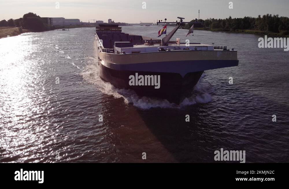 Aerial Across Bow Of Goudvis Inland Freighter Ship Traveliing Along ...