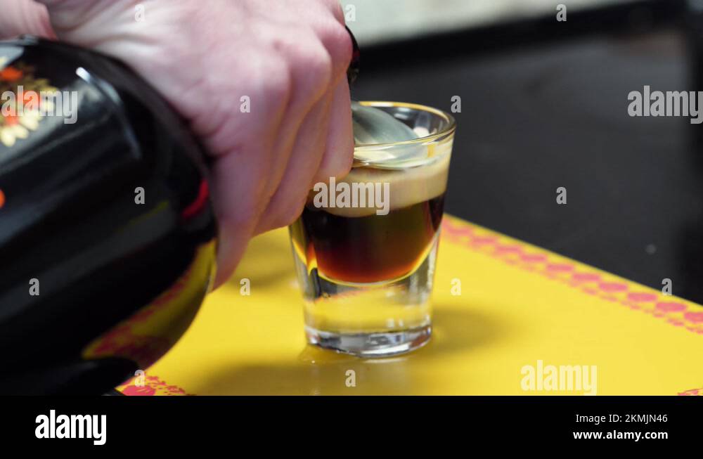 Pouring Cointreau Through The Back Of A Cold Spoon. B-52 Shot Layering ...