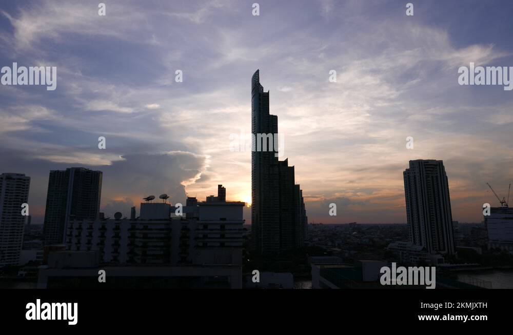 Very tall tower silhouette against sunset sky, light cirrus clouds at height Stock Video Footage ...