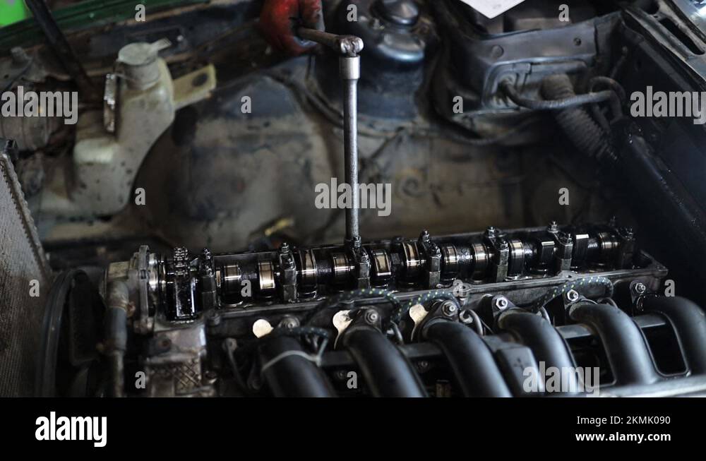 car engine repair, pulling cylinder head bolts with a torque wrench ...