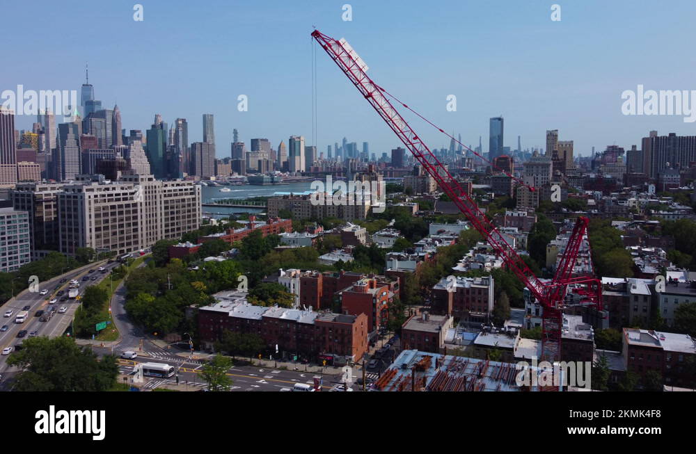 sunny flying counter clockwise around crane in Brooklyn with downtown ...