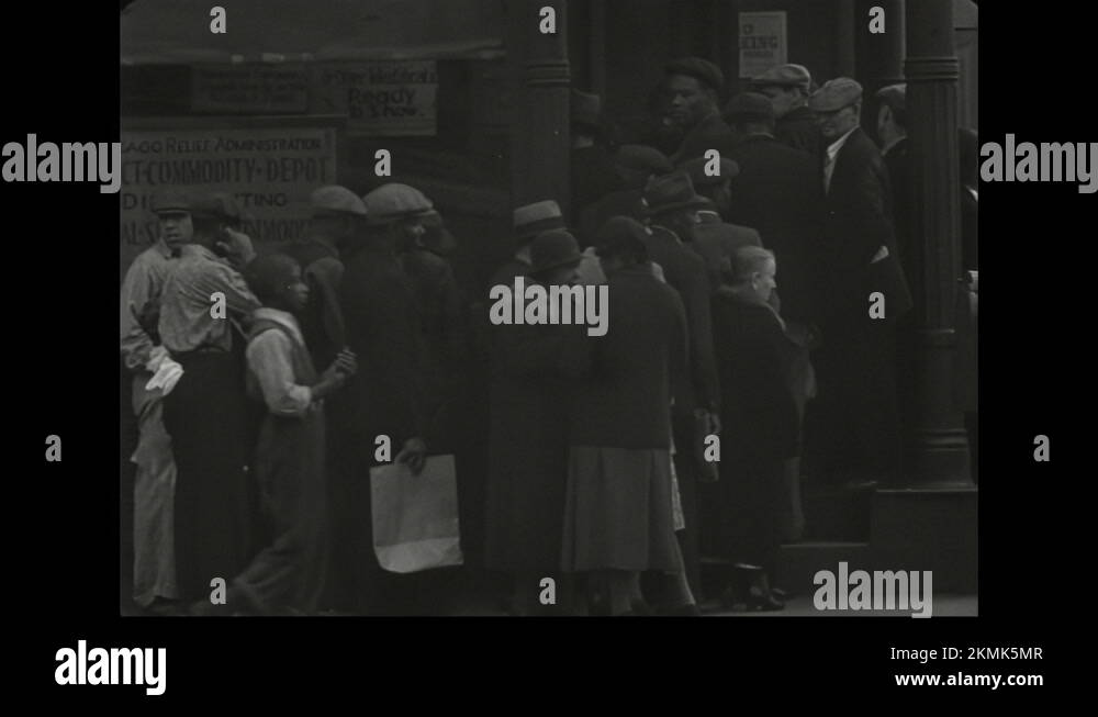1940s: People wait in two lines to go in building. People talk on stoop ...