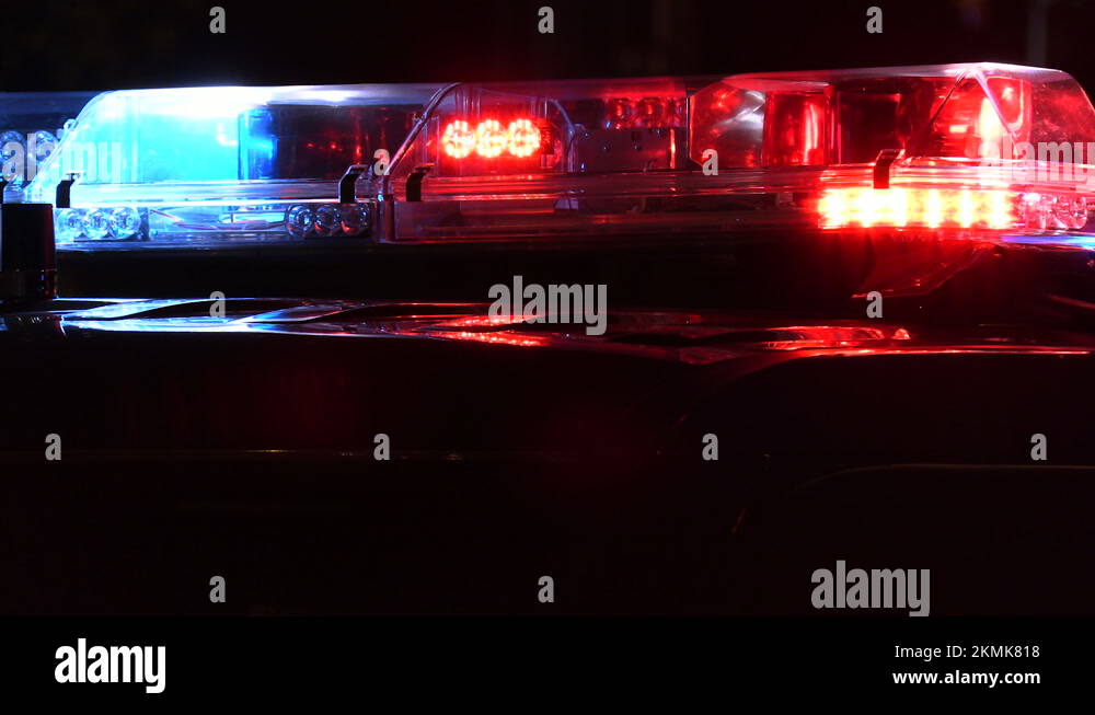 Multiple police cars at night with emergency lights flashing at crime ...