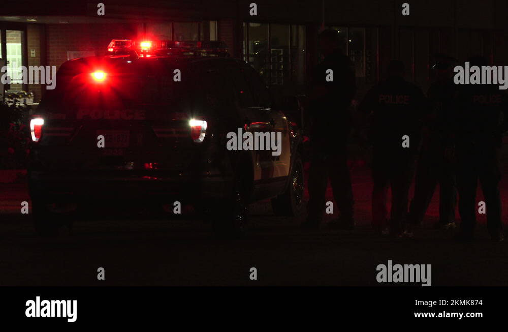 Multiple police cars at night with emergency lights flashing at crime ...