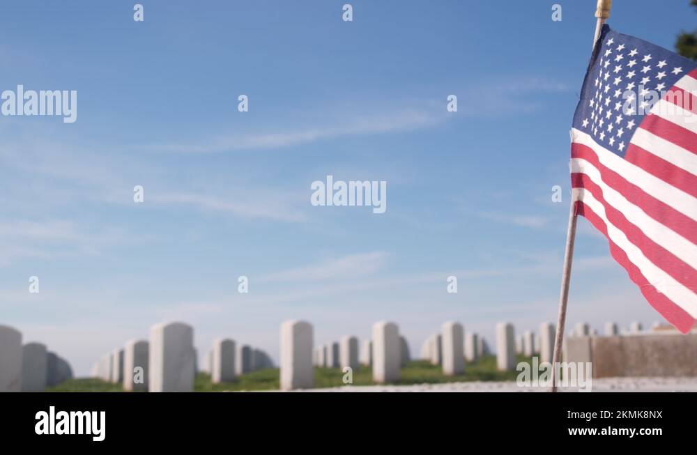 Tombstones and american flag, national military memorial cemetery in ...