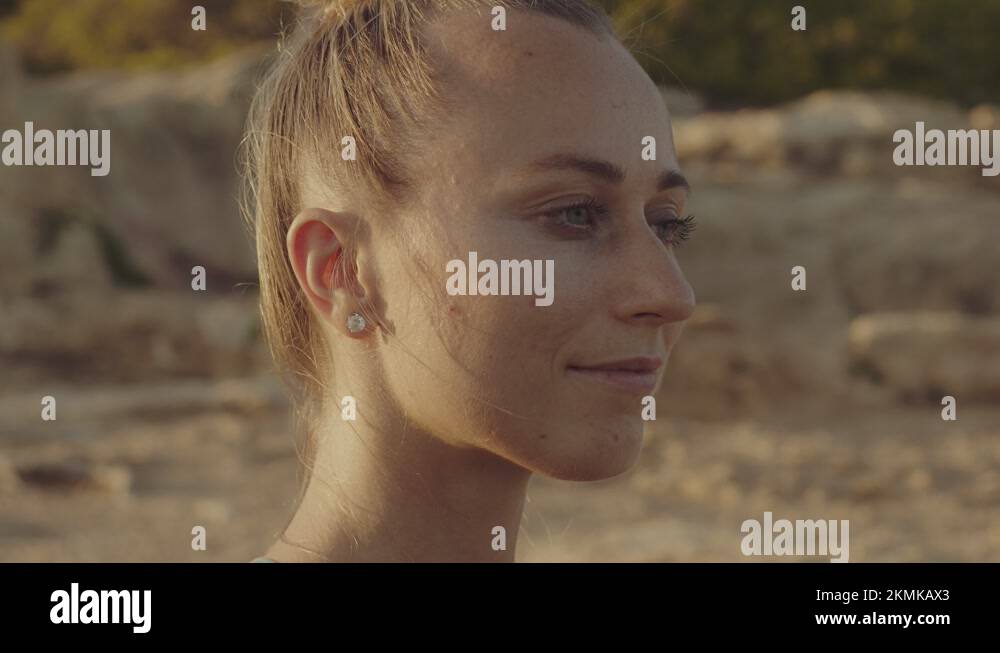 Beautiful blond hair and grey eyes girl. Caucasian female model turn ...