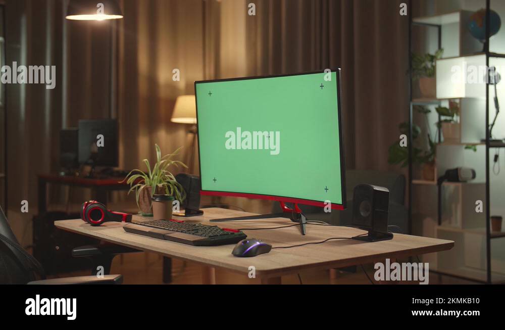 Desk With Mock Up Green Screen On Personal Computer With Big Display At ...