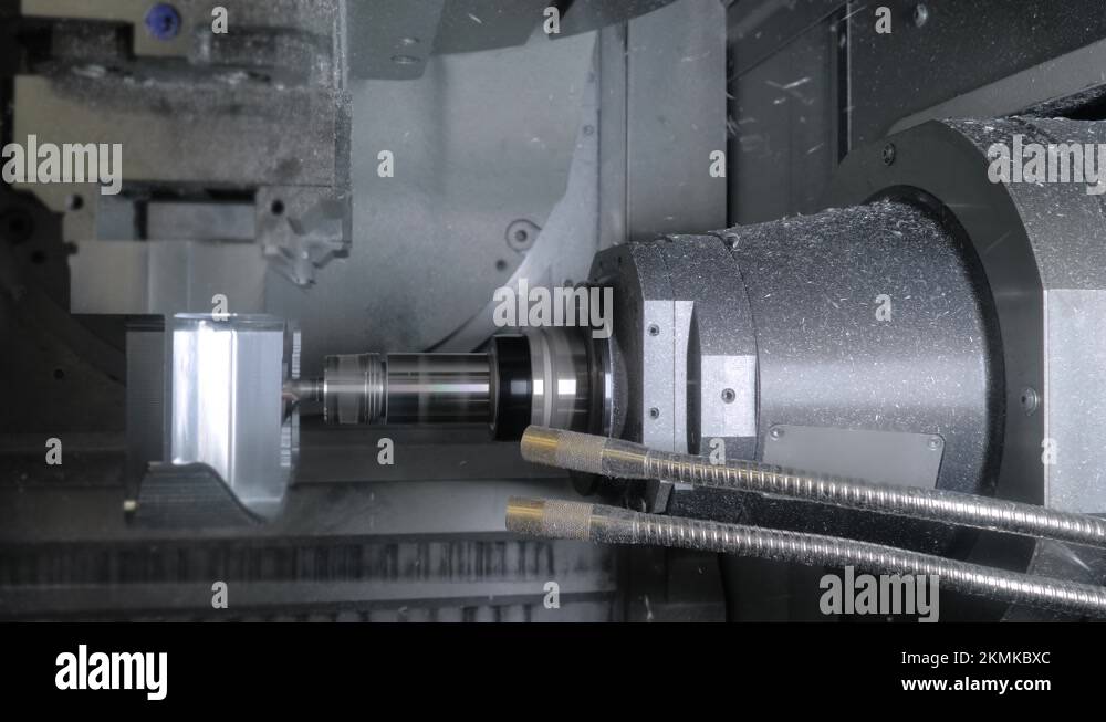 Turning milling combine machine cutting metal workpiece with shavings ...