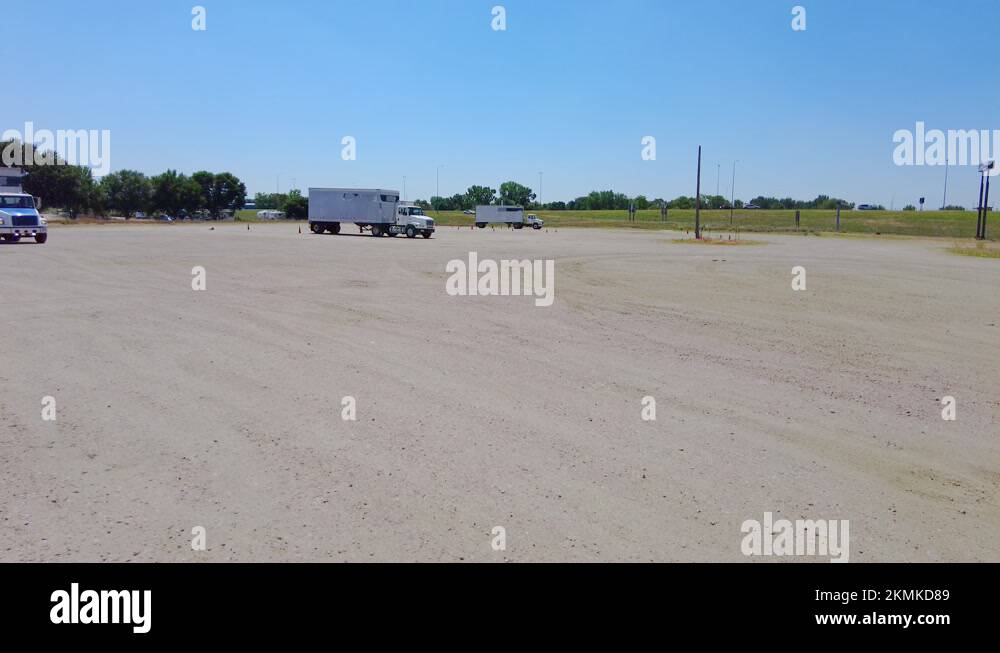 Student learning how to maneuver a semi tractor and trailer backwards ...