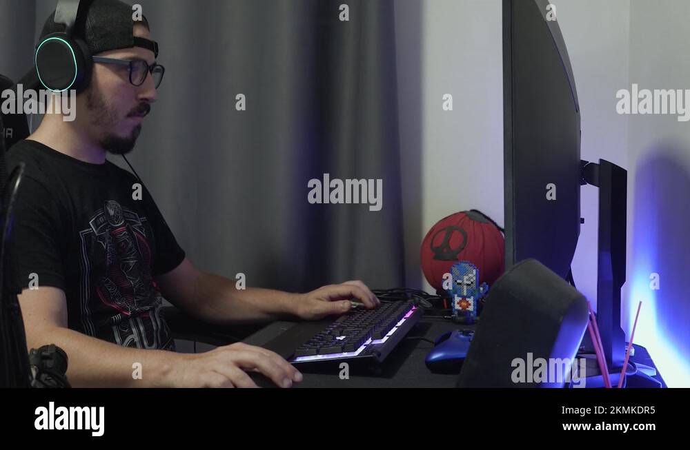 Gamer playing games on the PC with a full RGB Setup FullHD Stock Video ...