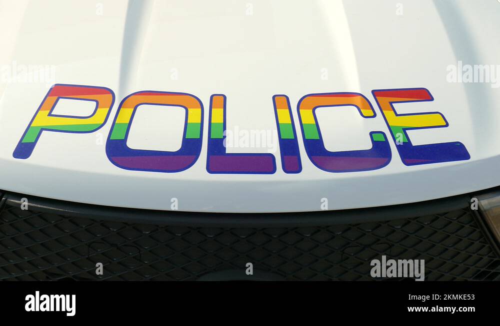 Police rainbow pride flag text logo on a car front hood with textured ...