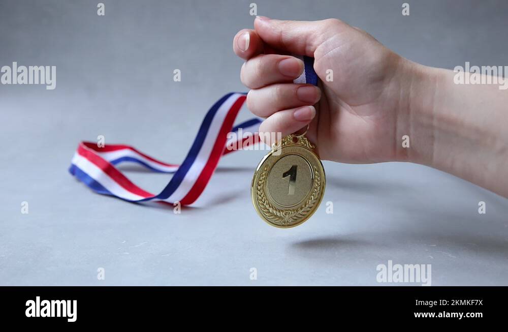 Winner holding medal Stock Videos & Footage - HD and 4K Video Clips - Alamy