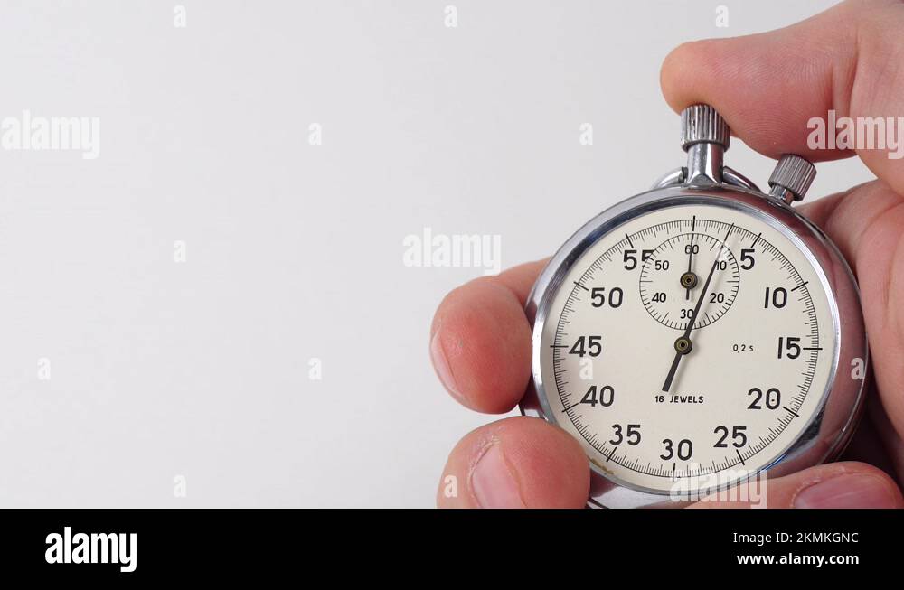 Human Hand hold classic steel mechanical analog stopwatch on white ...