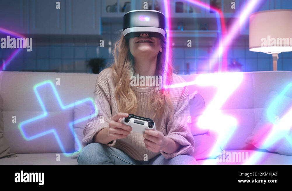 Young Woman Uses Virtual Reality in Headset Gaming Interface Looking ...