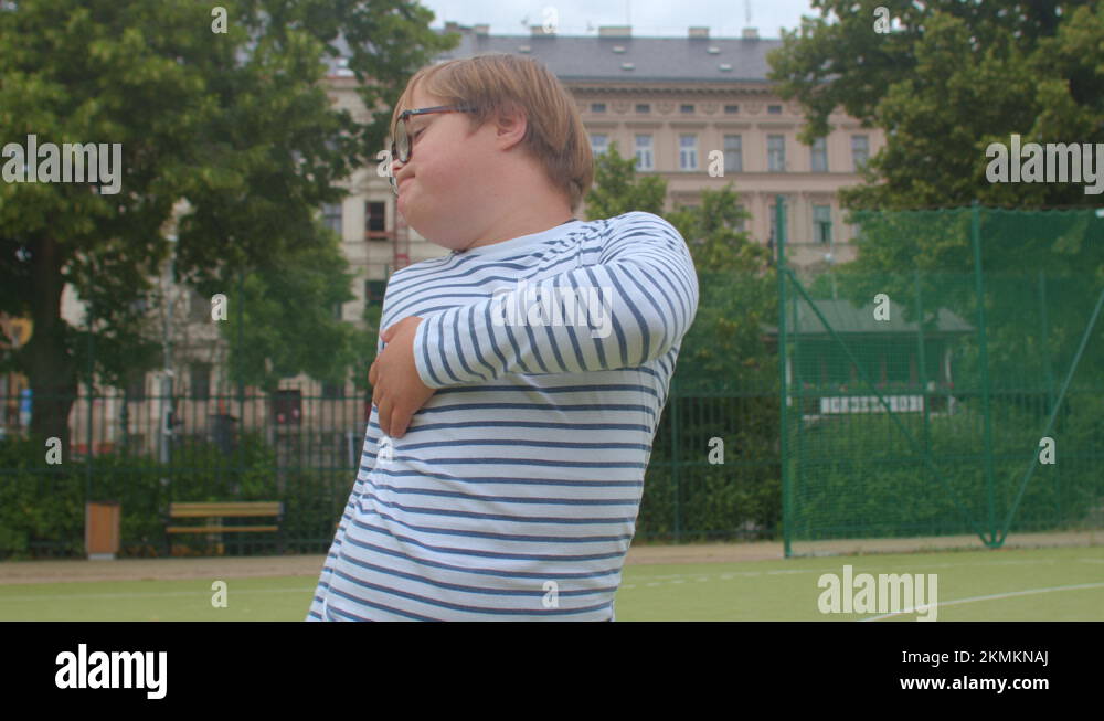 Down syndrome boy physically active hands. Expression emotions through ...