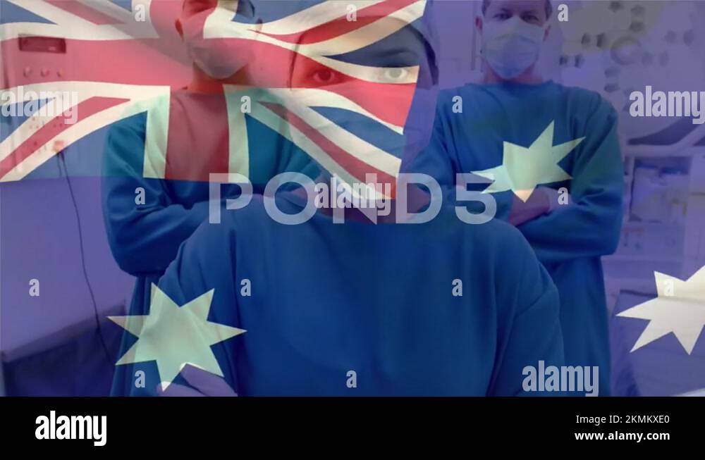 Australia flag waving against portrait of team of surgeons wearing face ...