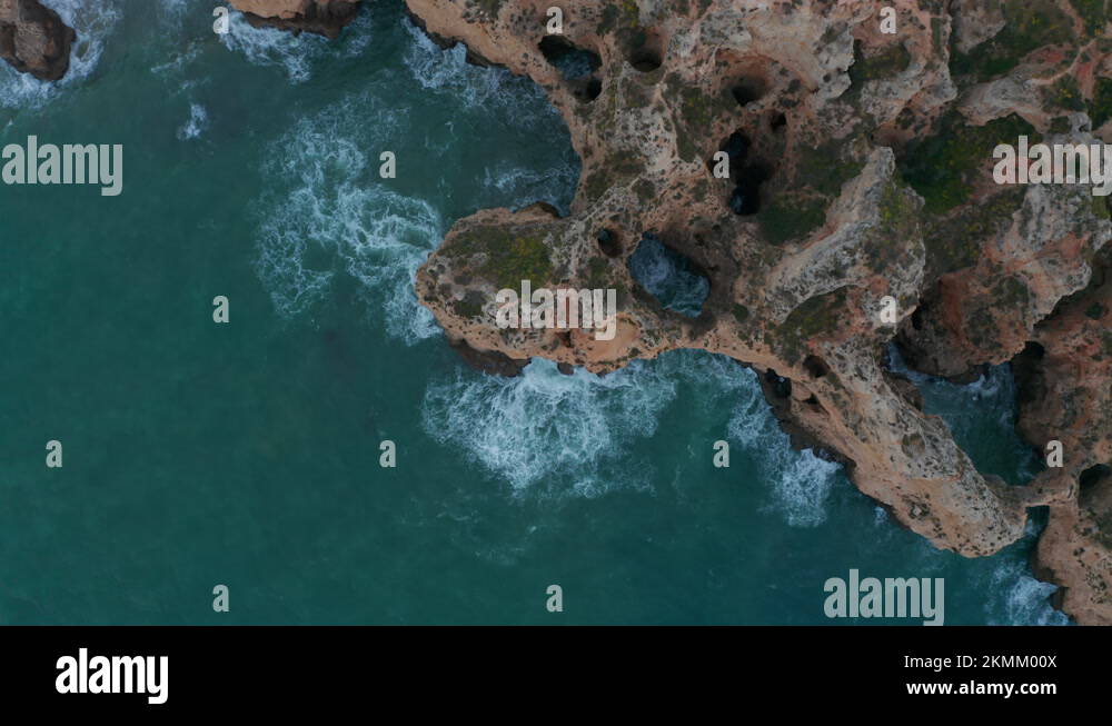 Aerial birds eye overhead top down view of scenic Lagos colored rocky ...