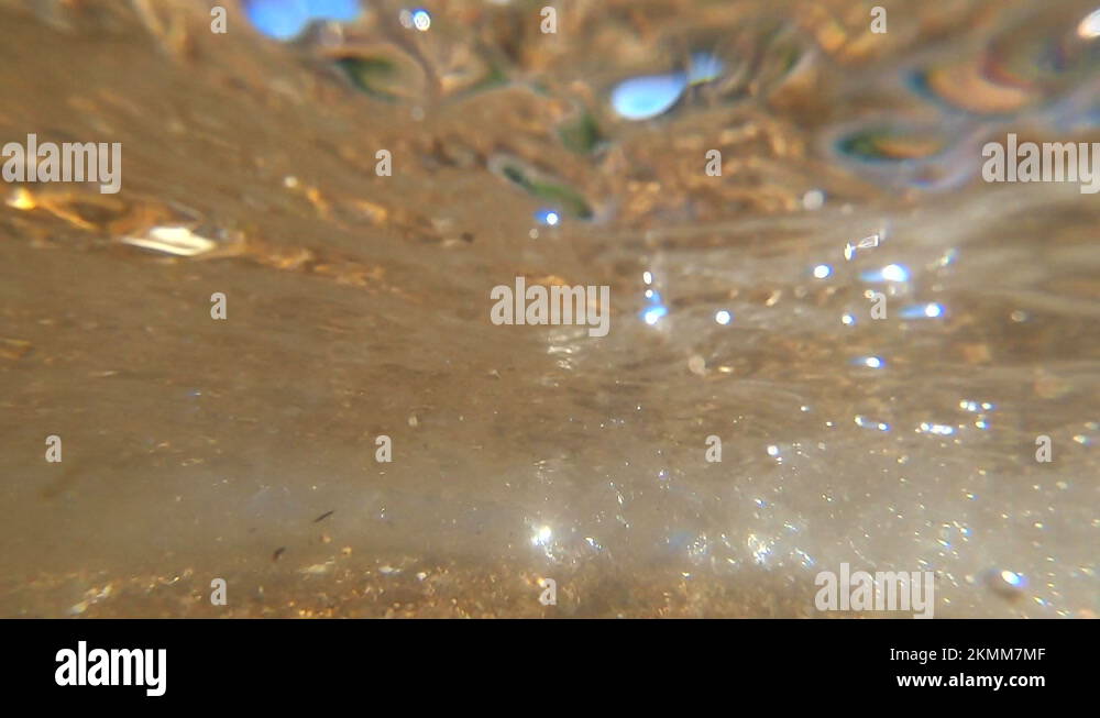 Pure and transparent water waves roll over camera. Bottom view Stock ...
