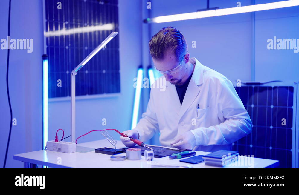 Lab person with glasses and gloves soldering solar cell 4K Stock Video ...