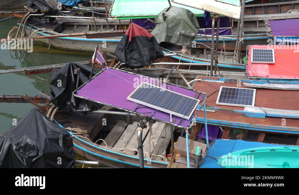 Thailand long tail boat park at pier port showing motor gas engine with ...
