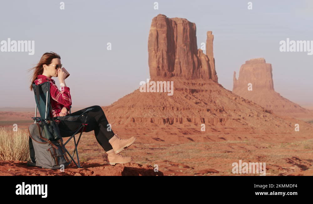 Explorer woman on adventure, traveller drinking tea with cinematic ...