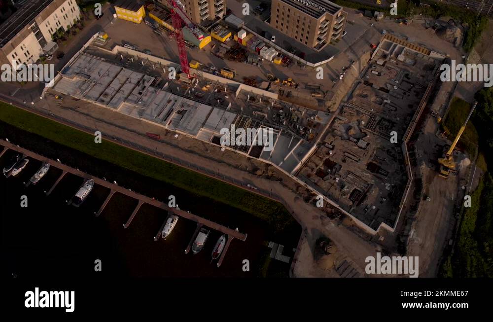 Top down backwards reveal movement showing the construction site with ...