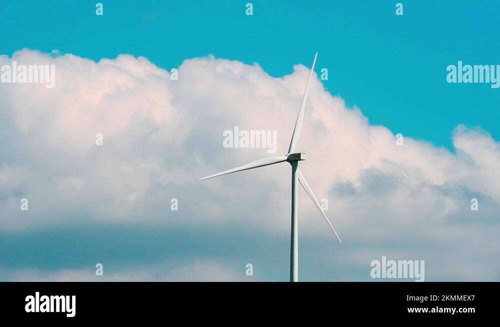 Static shot of single wind generator, the blades of a wind turbine ...