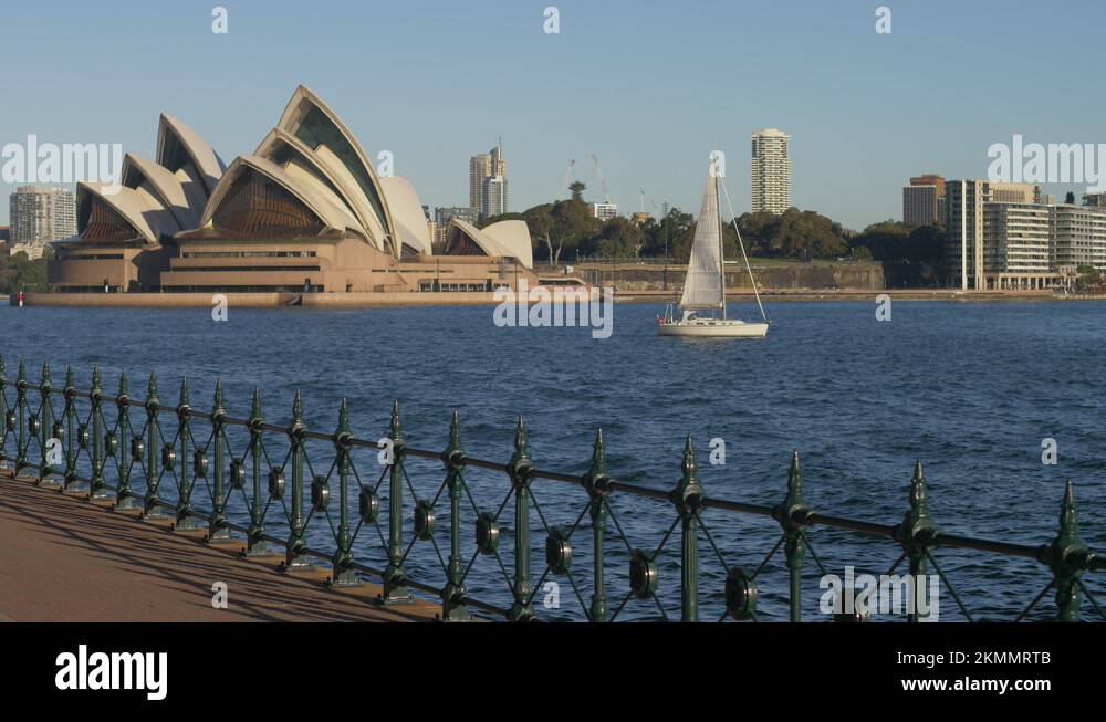 Slow motion sailing boat in the sun with Sydney Opera House background ...