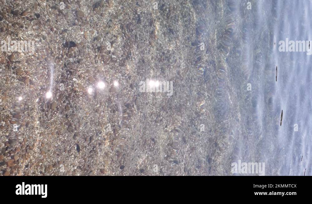 Pure sea water waves above pebble bottom video background Stock Video ...