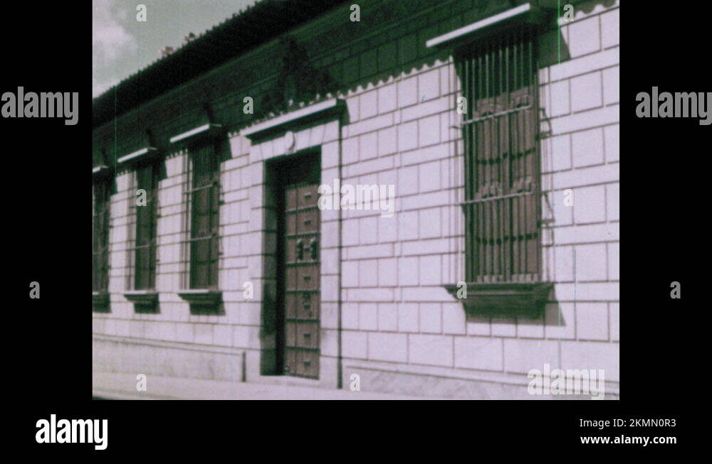 1960s: Front of wealthy home, bars on windows. Simón Bolívar rides horse on Stock Video Footage ...