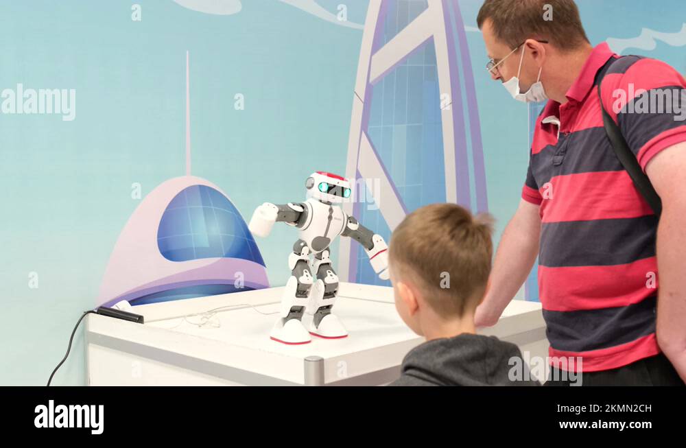 The father shows his son modern robots Stock Video Footage - Alamy