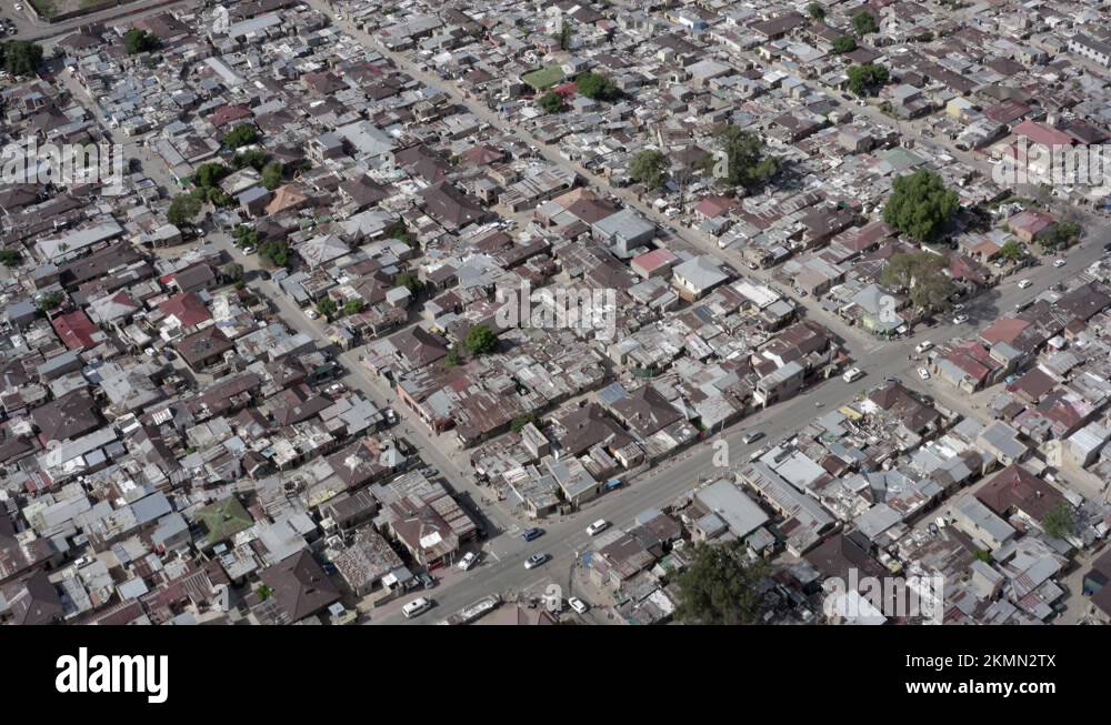 Arial shot half tilt down of Alexandra, a township in Johannesburg ...