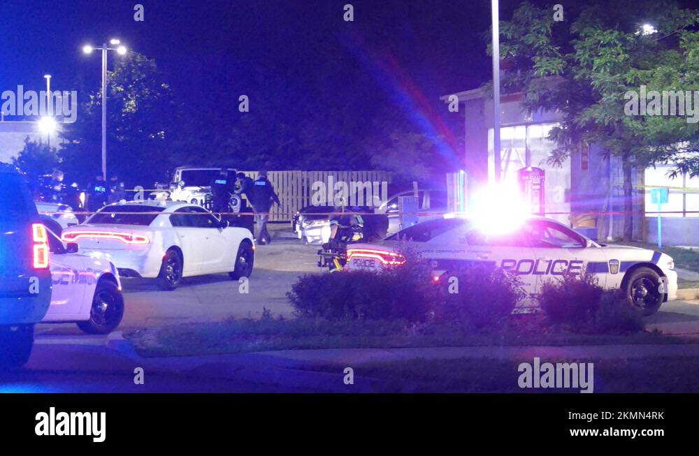 Flashy lights from police cars, the perimeters are secured with ...