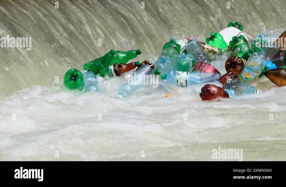Plastic garbage is carried by the river into the ocean, plastic bottles ...