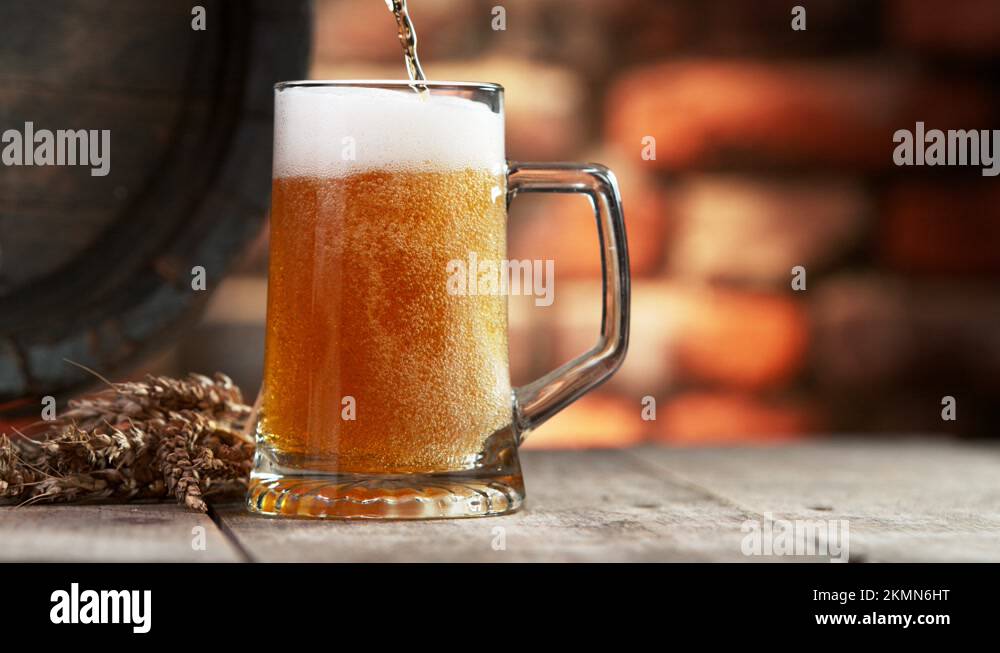 Super slow motion of pouring beer into glass, old cellar interior ...