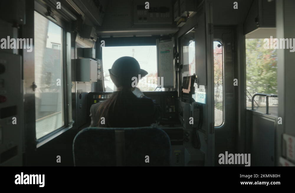 Backview Of A Woman Train Conductor Driving On Cockpit In Sendai, Japan ...
