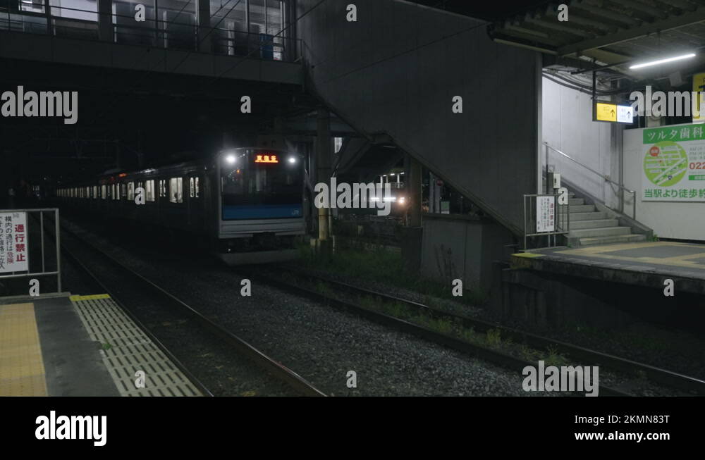 Modern Train In Sendai, Japan Arriving At The Station At Night. static ...