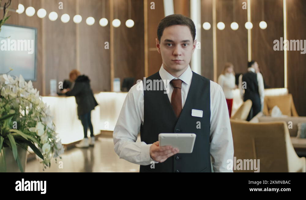 Male receptionist Stock Videos & Footage - HD and 4K Video Clips - Alamy