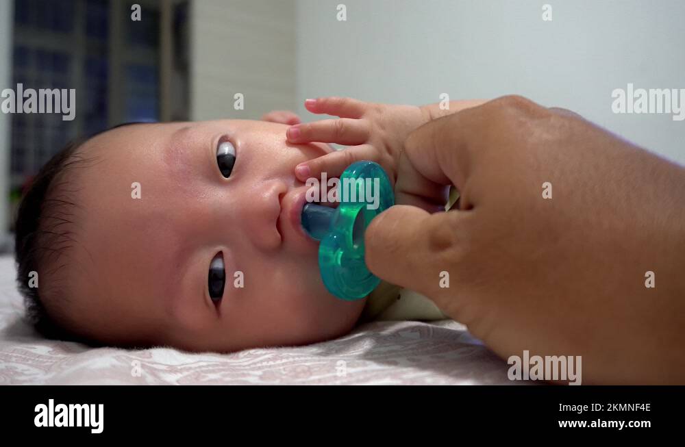 Father hand put pacifier into baby mouth. Ultra wide view Stock Video ...