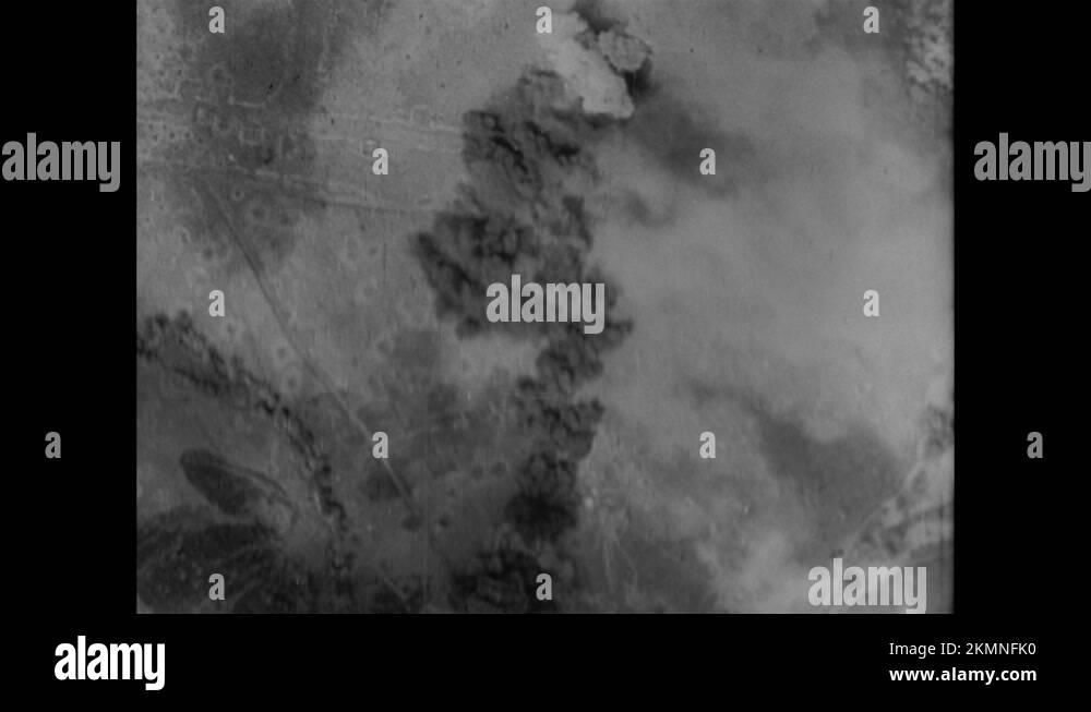 1940s: Military planes fly in sky. Bombs hit the ground. Crosses and ...