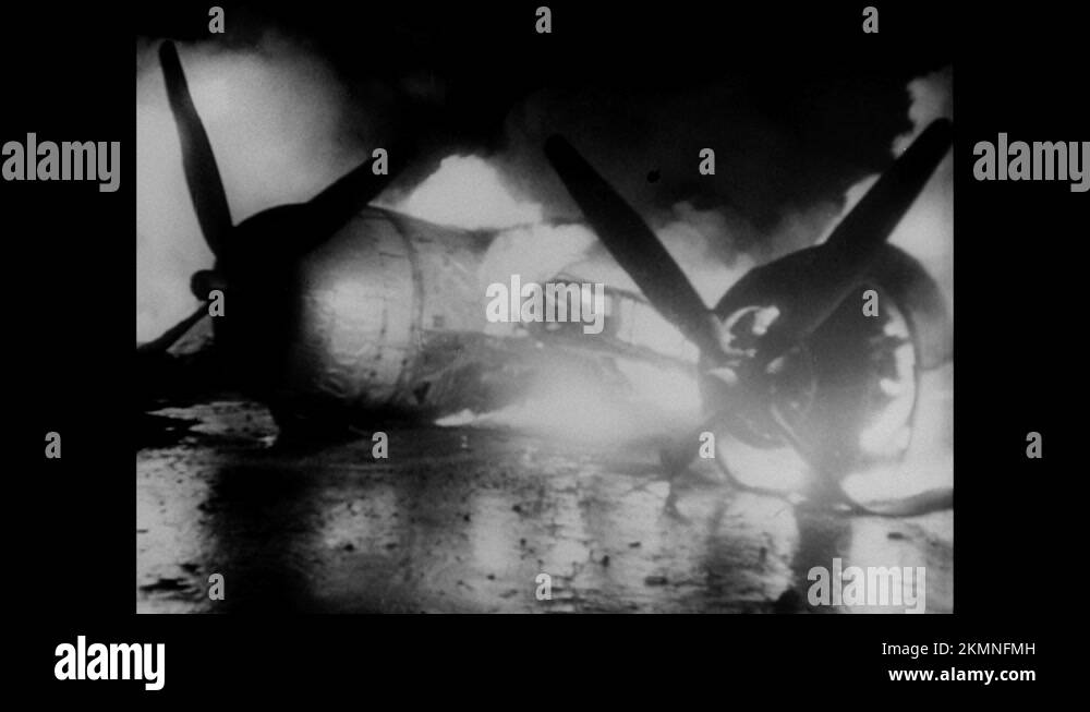 1940s: American airplanes on runway burning. Destroyed planes on ground ...