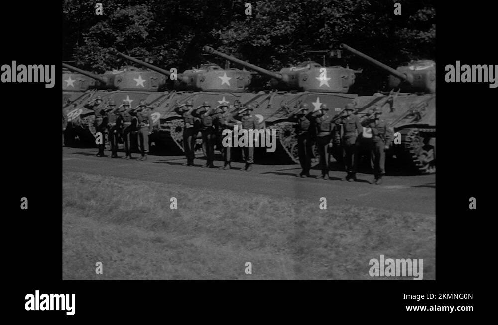 1940s: Soldiers stand at attention by tanks, in row. Franklin D ...