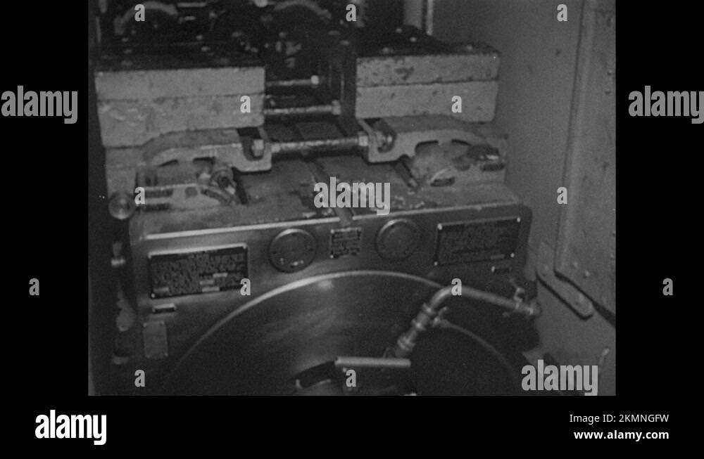 1940s: Ship. Men load ammunition into weapon. Ship raises guns and ...