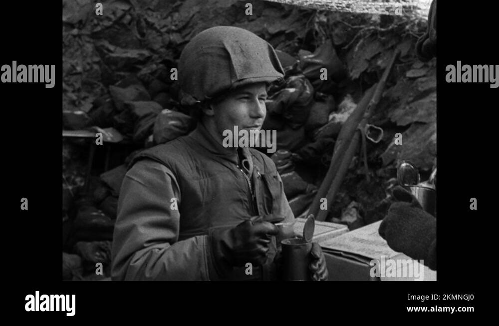 1940s: Soldiers eat rations at base. Soldiers grab food from around ...