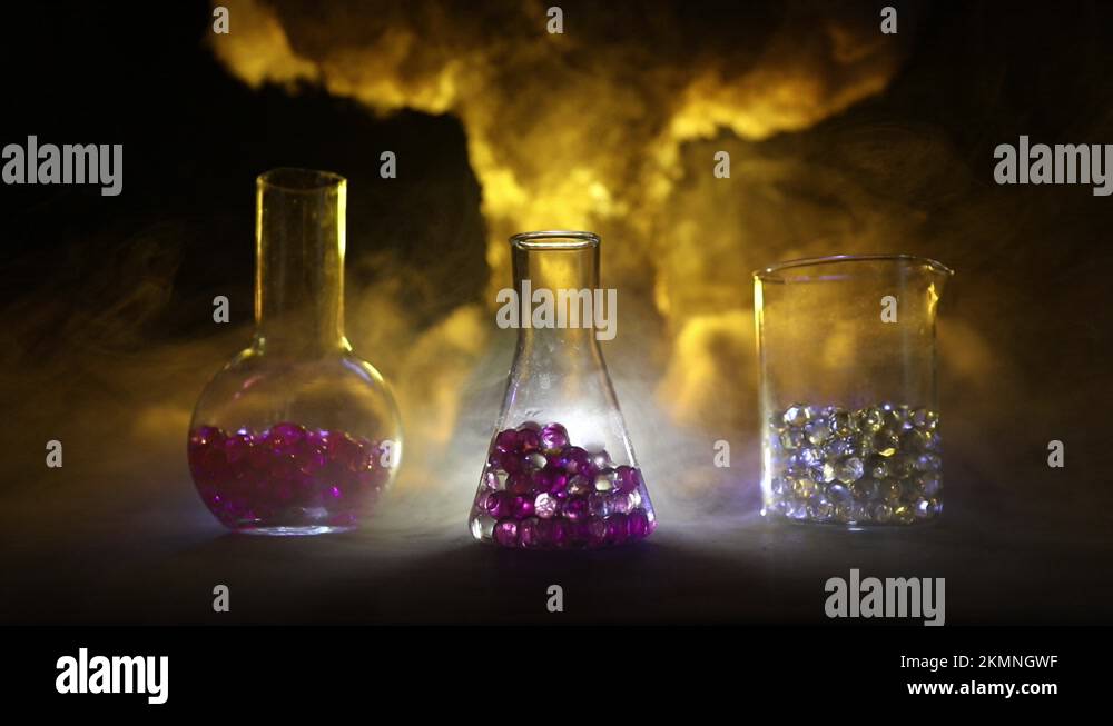 Laboratory test tubes on abstract explosion cloud background Stock ...