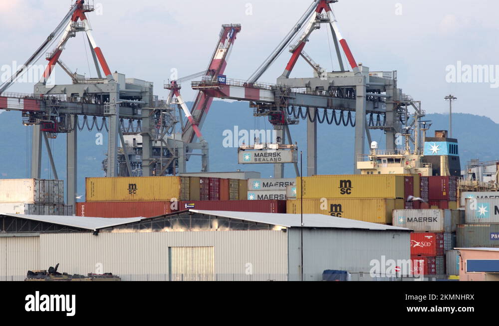 Container Port and Crane in La Spezia Port, rising containers from ship ...