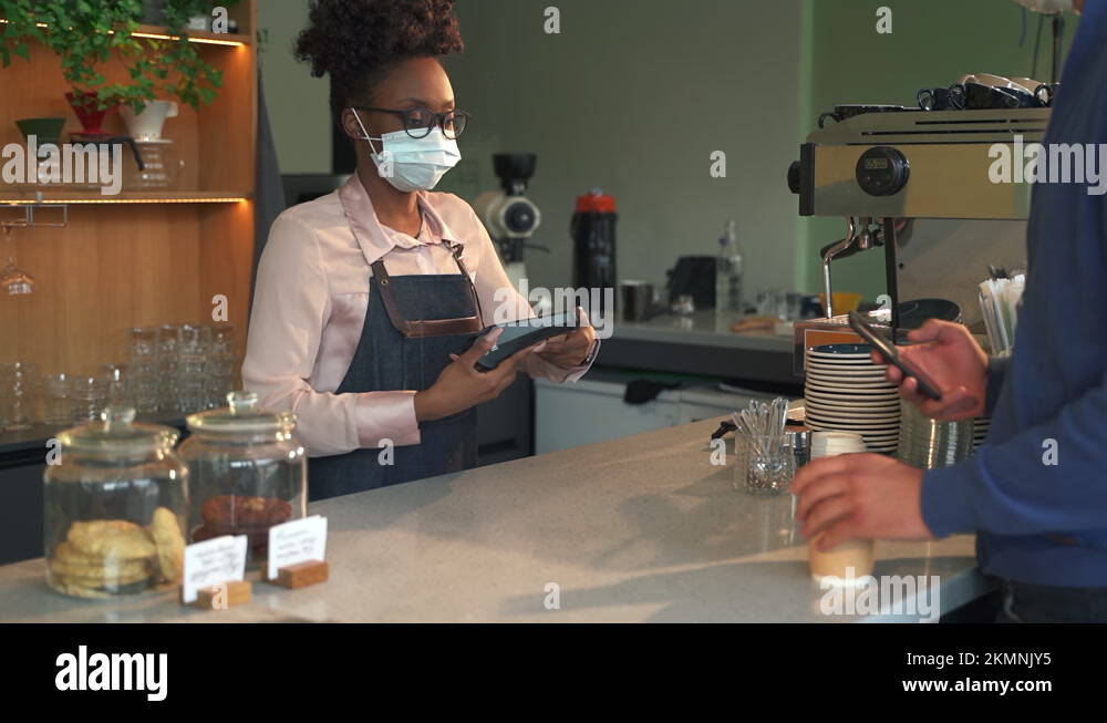 Coffee shop service new normal black woman with and terminal Spbas ...