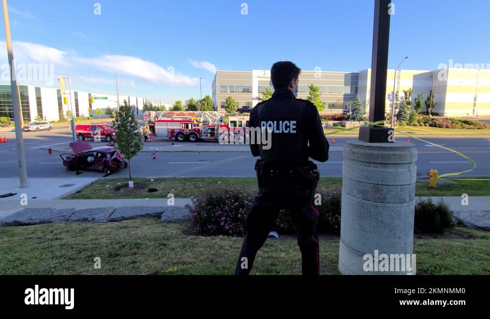 Policeman Sealing Off Area Of Car Crash Accident With Yellow Barricade ...