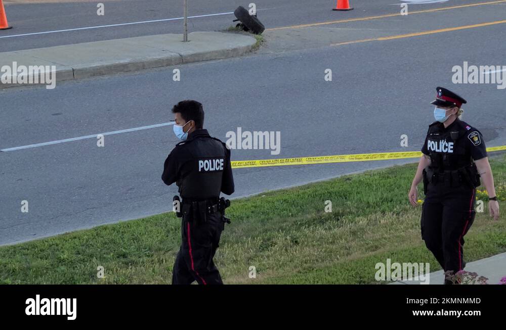 Police Officers In Masks Cordoning Perimeter Of Fatal Car Crash ...