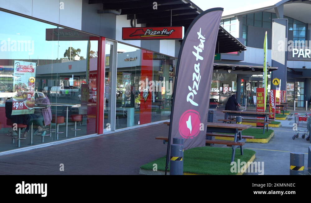 PizzaHut fast food pizza restaurant logo sign hanging on storefront ...
